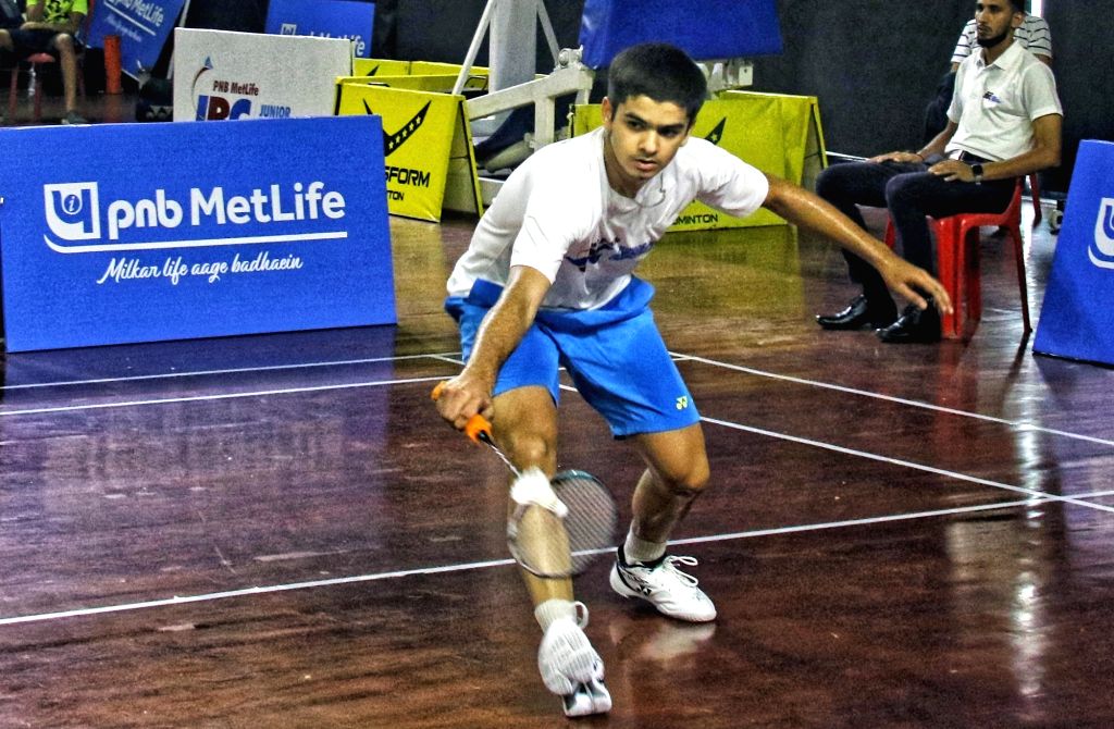 A Badminton player plays a shot during the final match