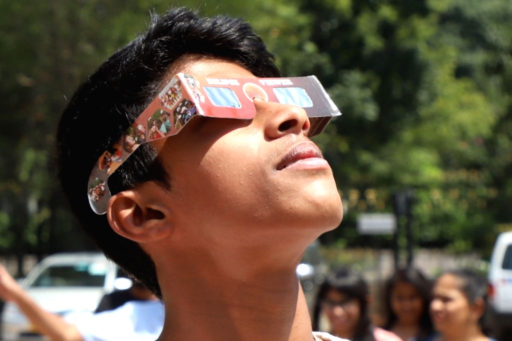 A boy seen wearing Eclipse viewer equipment at Nehru Planetarium