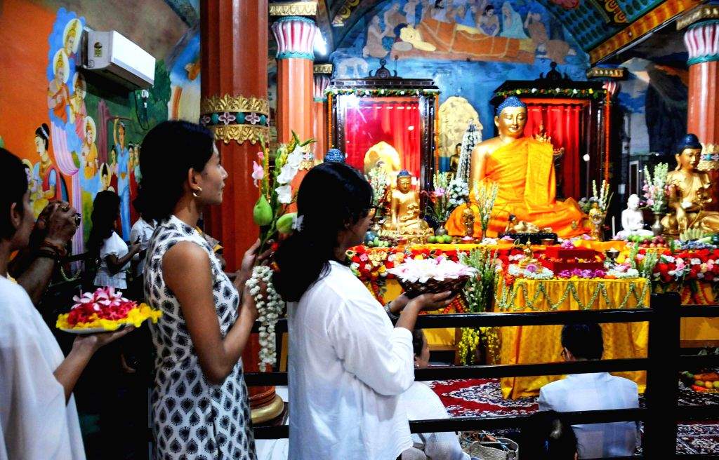A Buddhist monk offers prayer to Lord Buddha on the occasion of Buddha ...