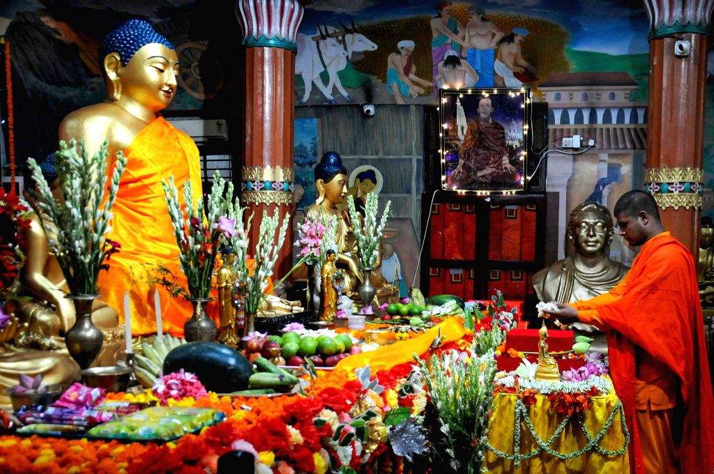 A Buddhist monk offers prayer to Lord Buddha on the occasion of Buddha ...