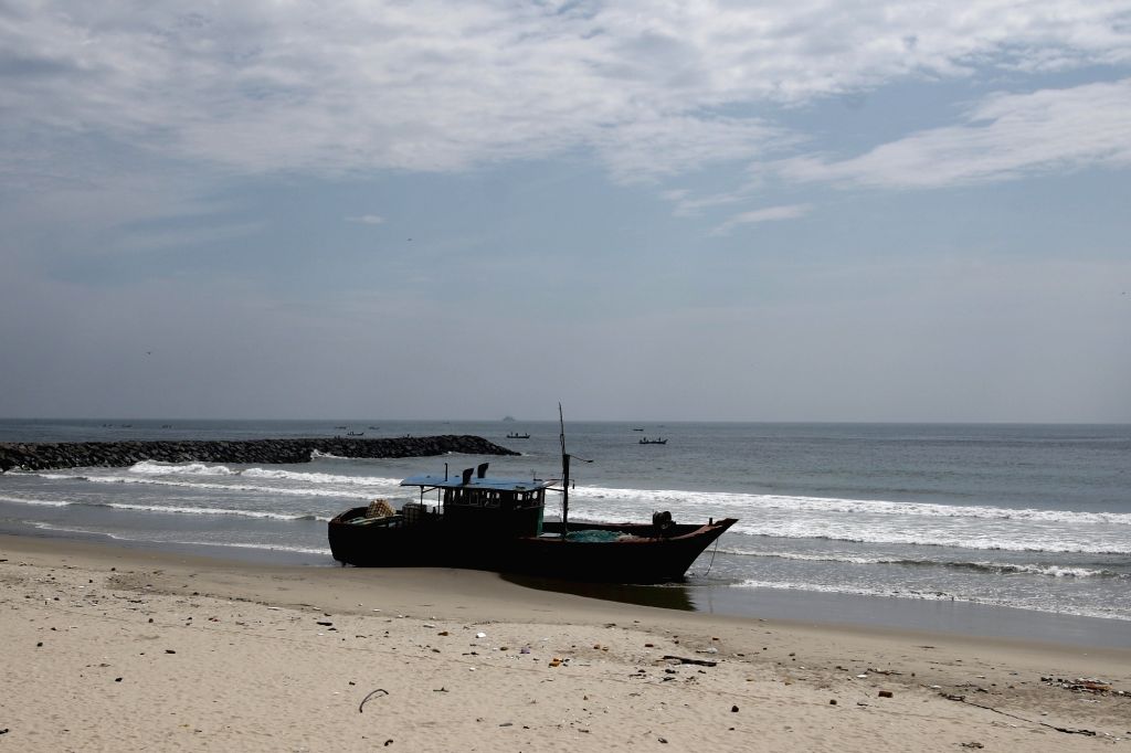 Fishing boat stranded along a beach at Kasimedu fishing harbour