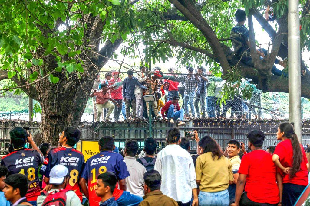 A huge crowd RCB fans gather outside M Chinnaswamy Stadium in Bengaluru