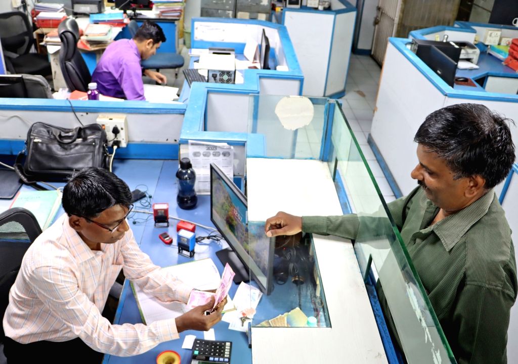 A man deposits Rs 2000 currency notes at a bank