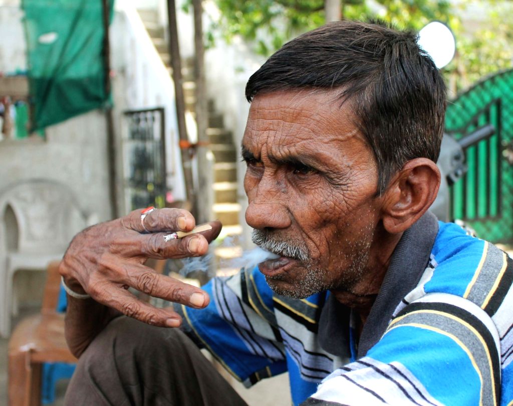 World No Tobacco Day' - Man smoking bidi