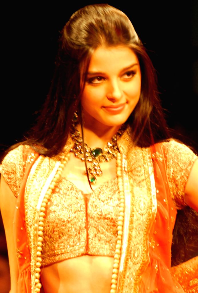 A model showcases a design by Ritu Kumar on the catwalk during the ...