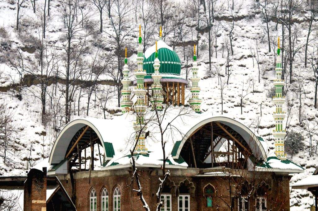 A mosque covered in snow after a fresh snowfall