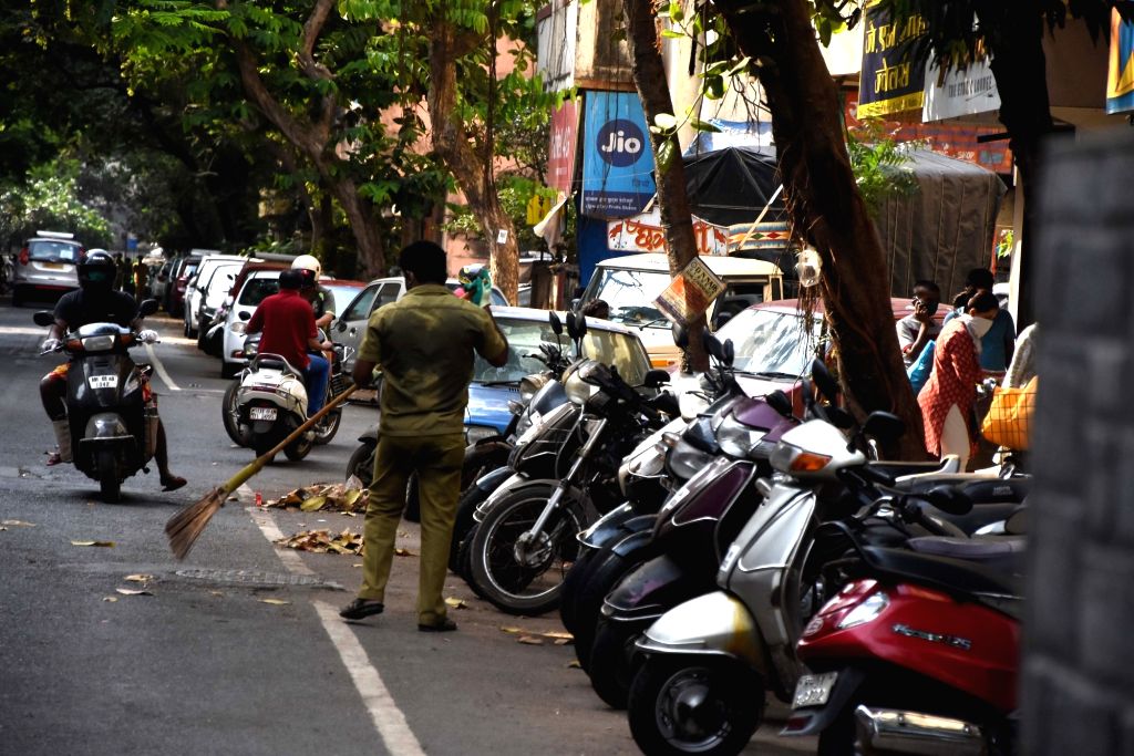International Workers' Day - Municipal worker sweeping the street