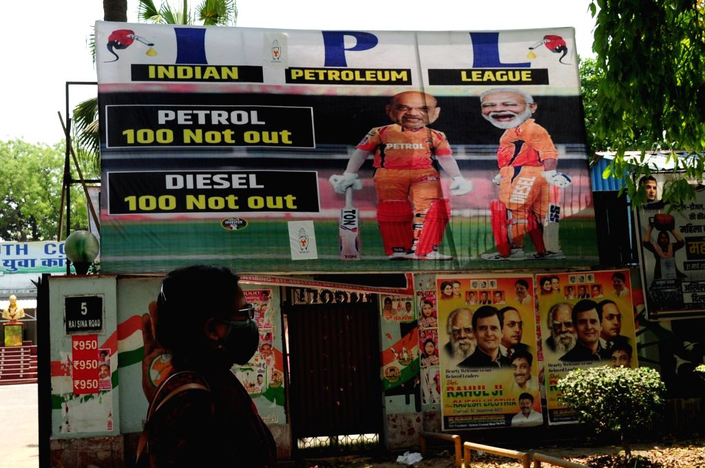 A poster depicting the image of PM Modi and Home Minister Amit Shah ...