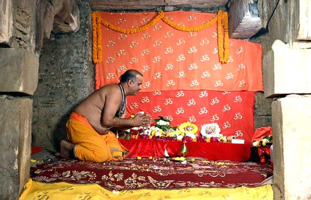 A priest offers prayers at 'Vyas Ji ka Tehkhana' inside Gyanvapi mosque ...