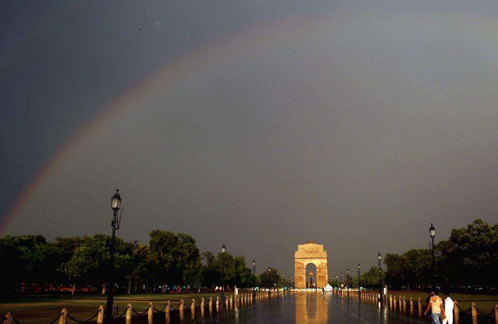 A rainbow is seen above India Gate after a downpour