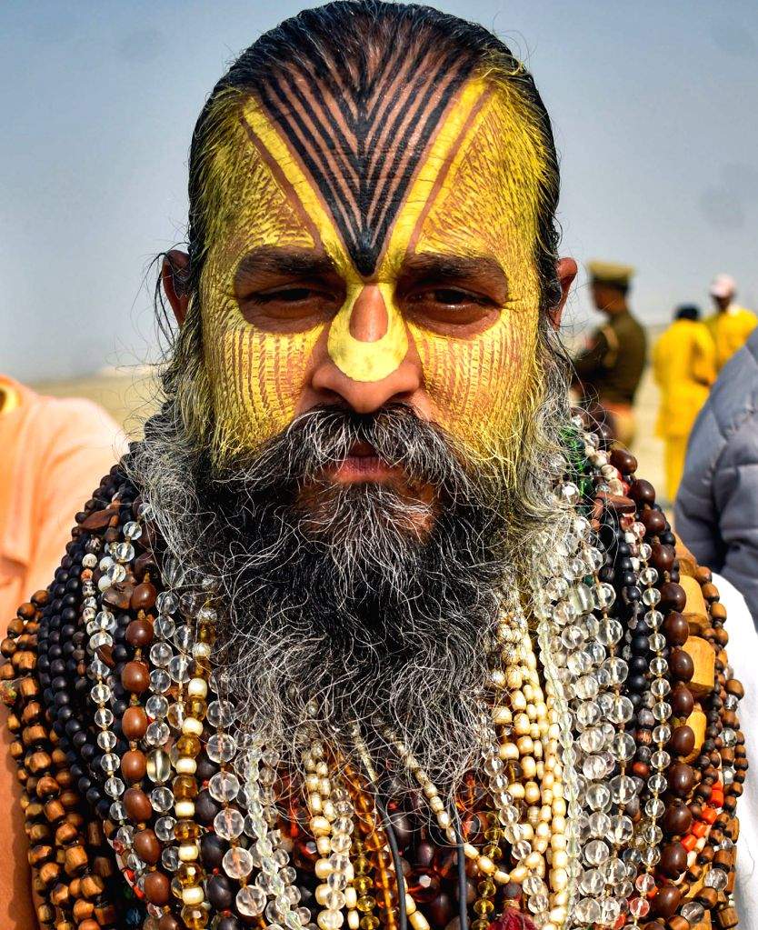 A Sadhu (holy man) wearing 'Rudraksha' poses for photos ahead of the ...
