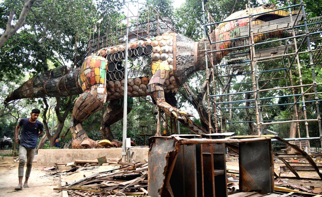 A sculpture of a dinosaur made from upcycled metal is displayed at the ...