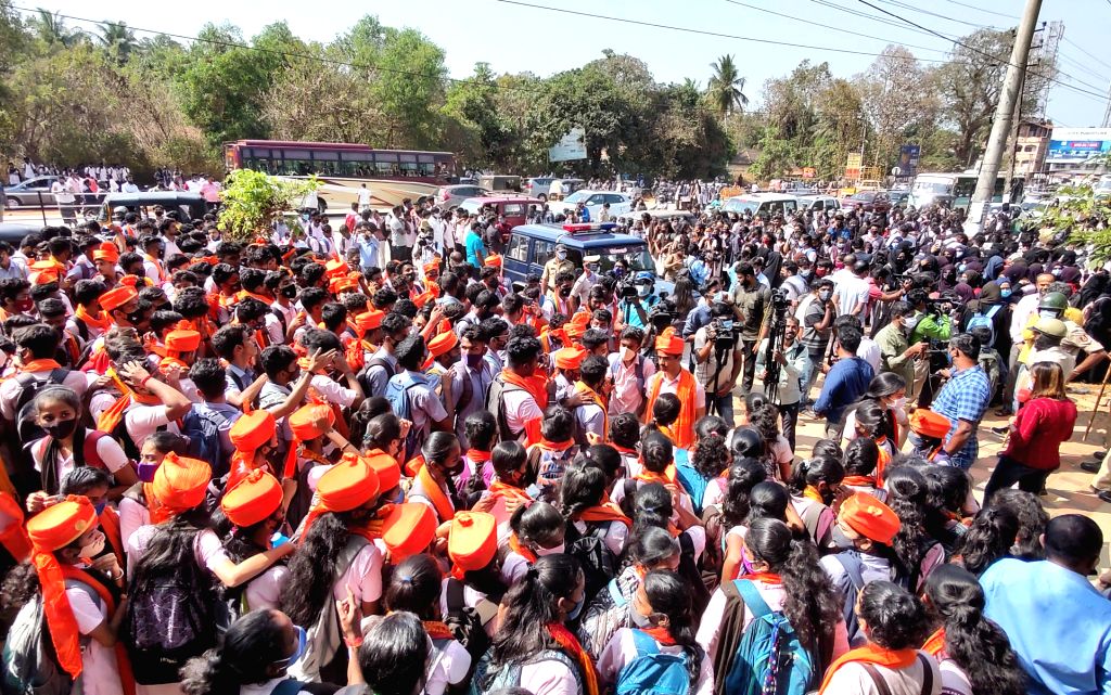 A section of students of DVS College protested with saffron scarves.