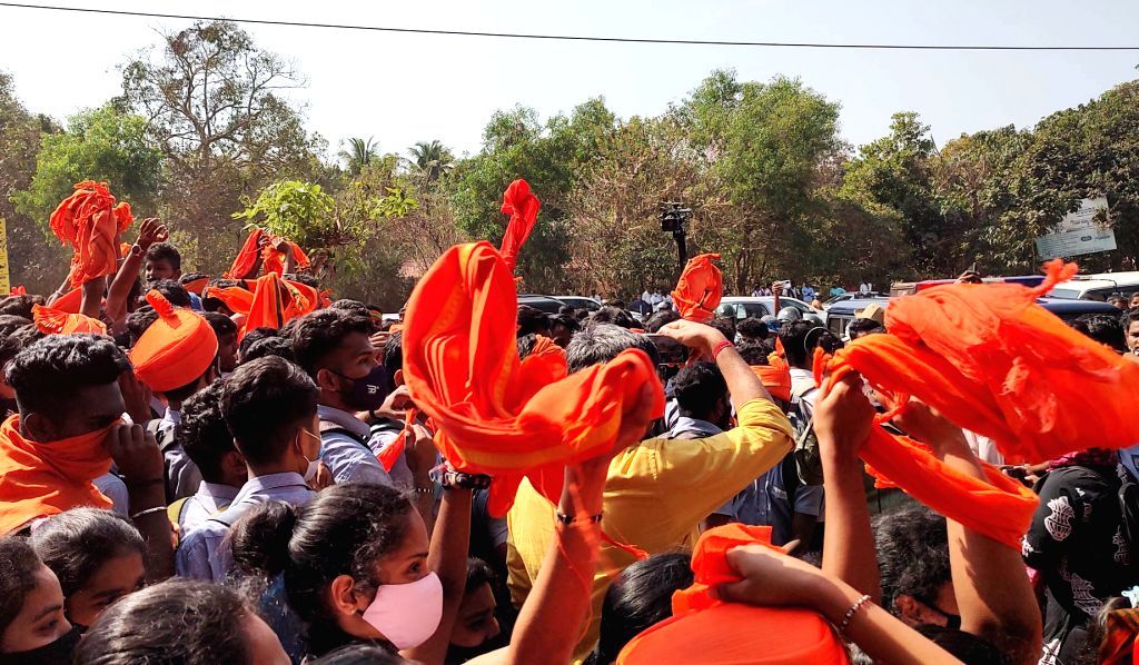 A section of students of DVS College protested with saffron scarves.