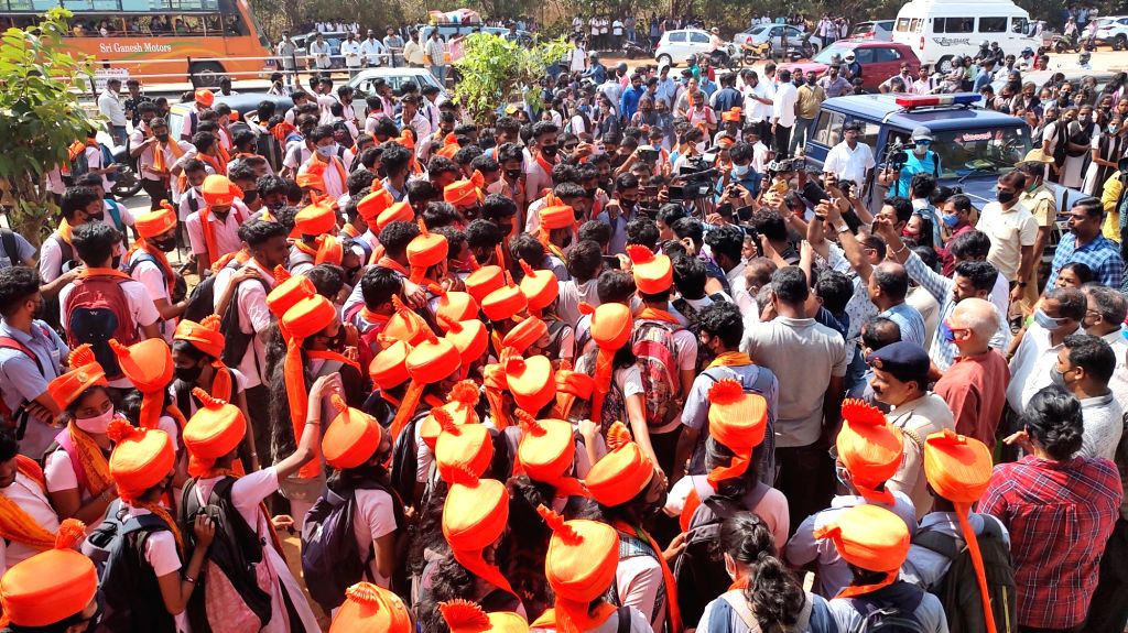 A section of students of DVS College protested with saffron scarves.