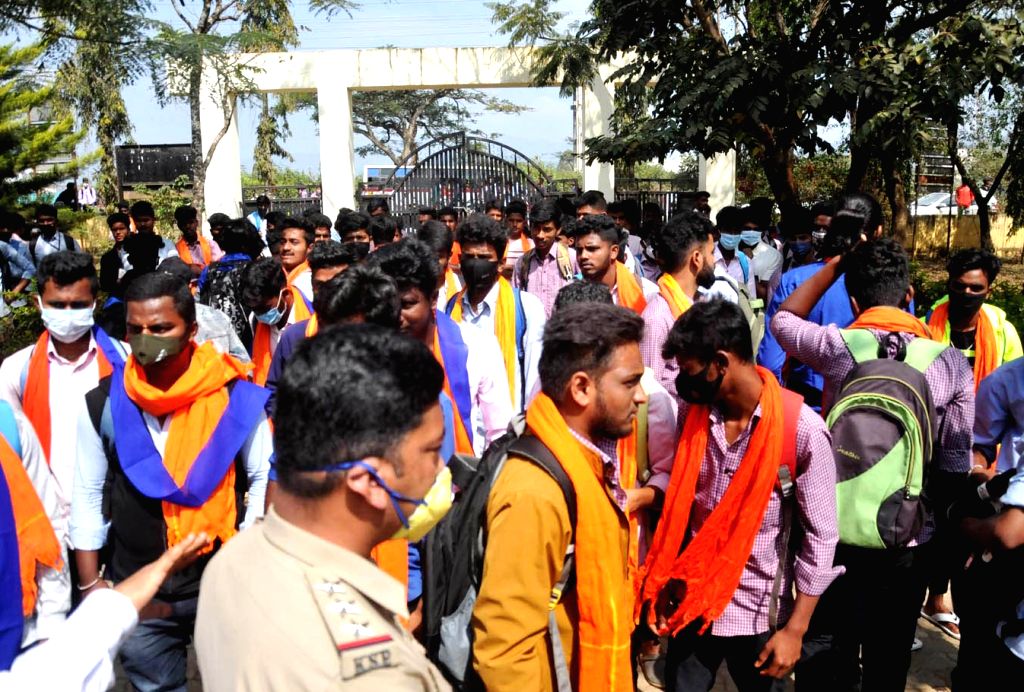 A section of students of DVS College protested with saffron scarves.