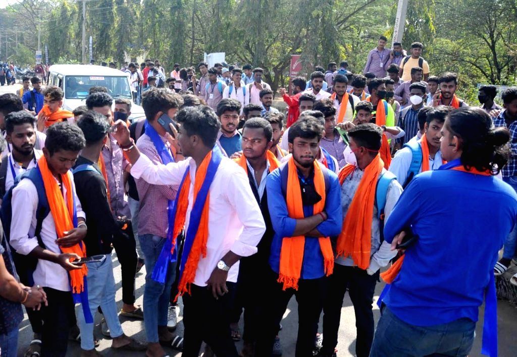A section of students of DVS College protested with saffron scarves.