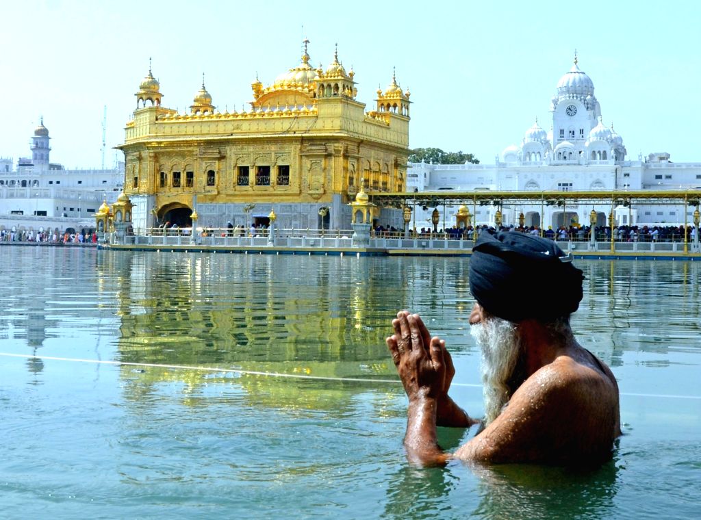 A Sikh devotee takes a dip in the holy 'Sarovar