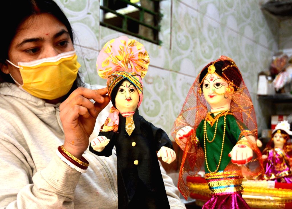 A sweet maker shows sweet dolls (Khirer Putul)