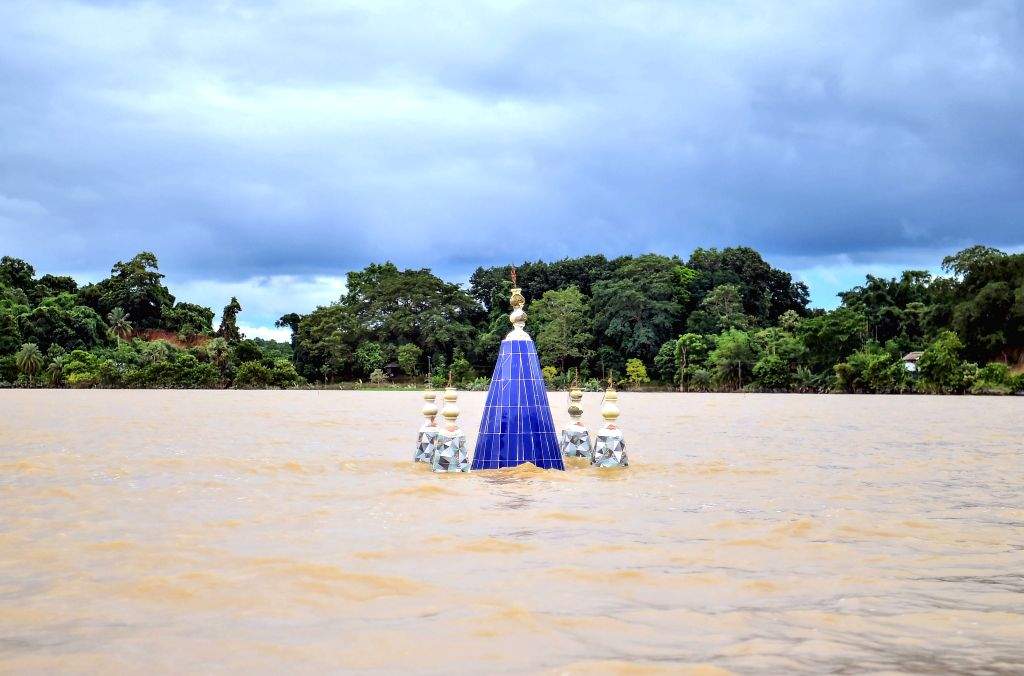 A temple partially submerged in flood water following heavy rainfall on ...