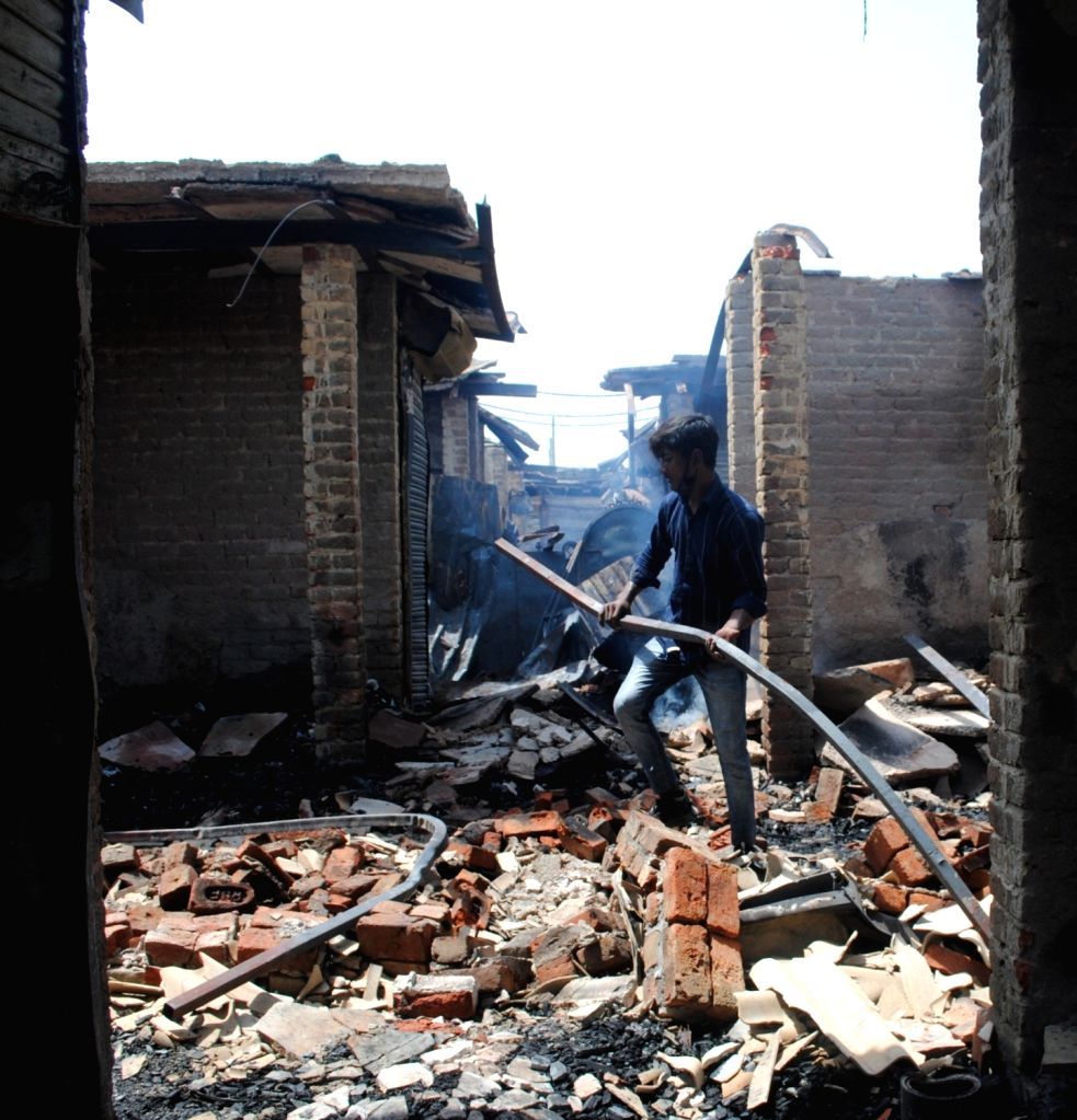 A view of Burn shops and Eight people rescued from the fire in a ...