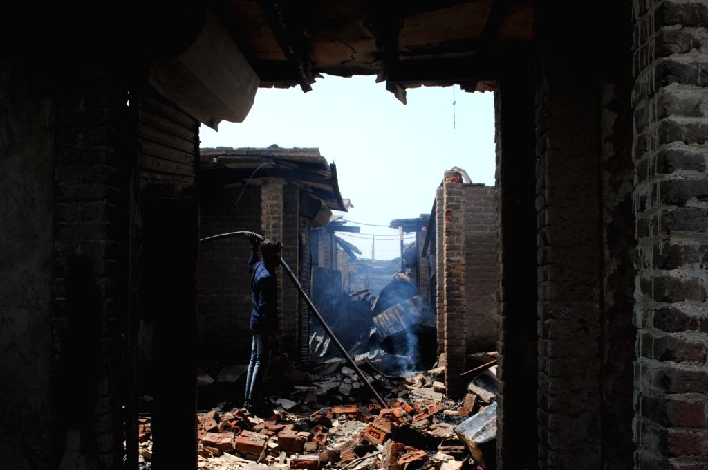 A view of Burn shops and Eight people rescued from the fire in a ...