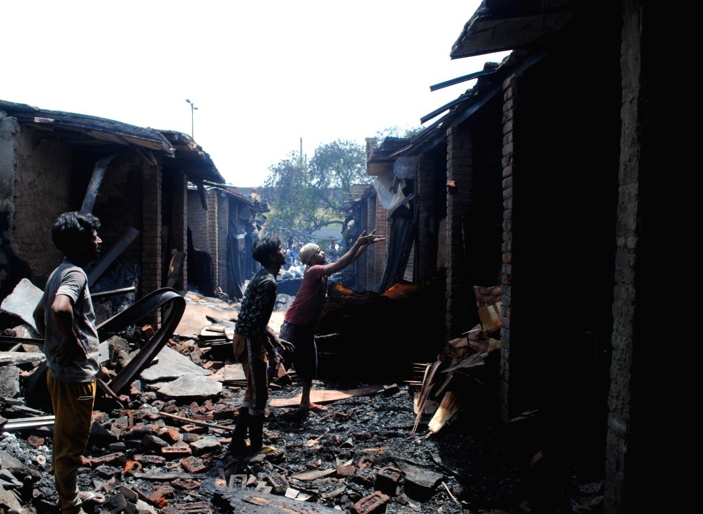 A view of Burn shops and Eight people rescued from the fire in a ...