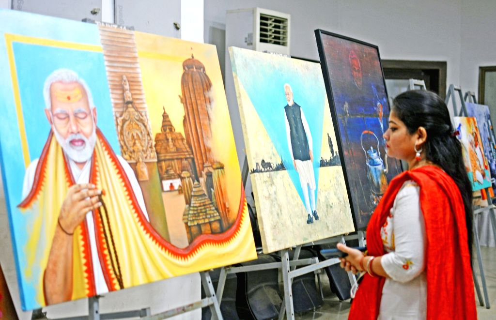 A visitor at an art exhibition 'Modi @20
