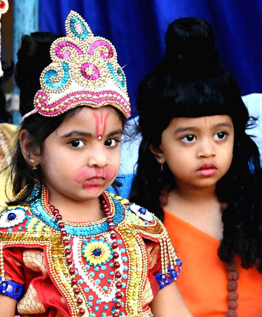 A young boy dressed as Lord Ram participates during the celebrations of ...