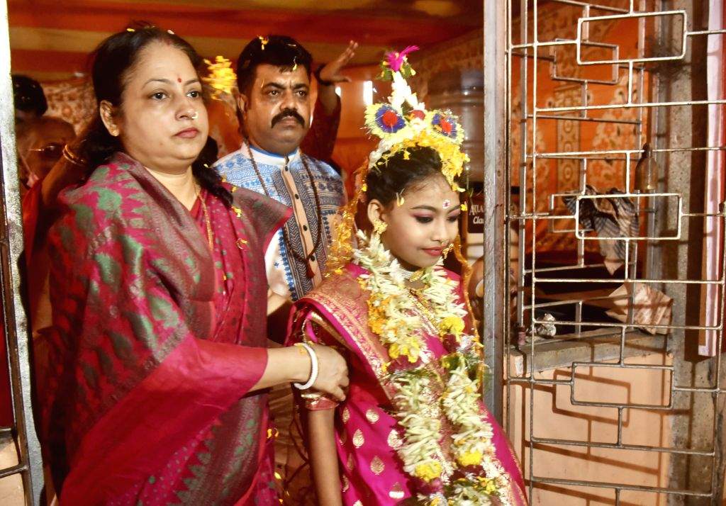 A Young Girl Is Being Worshipped During The ‘kumari Puja