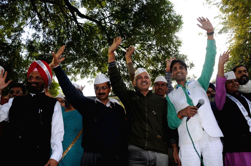 Aam Aadmi Party supporters during a victory rally at Jantar Mantar