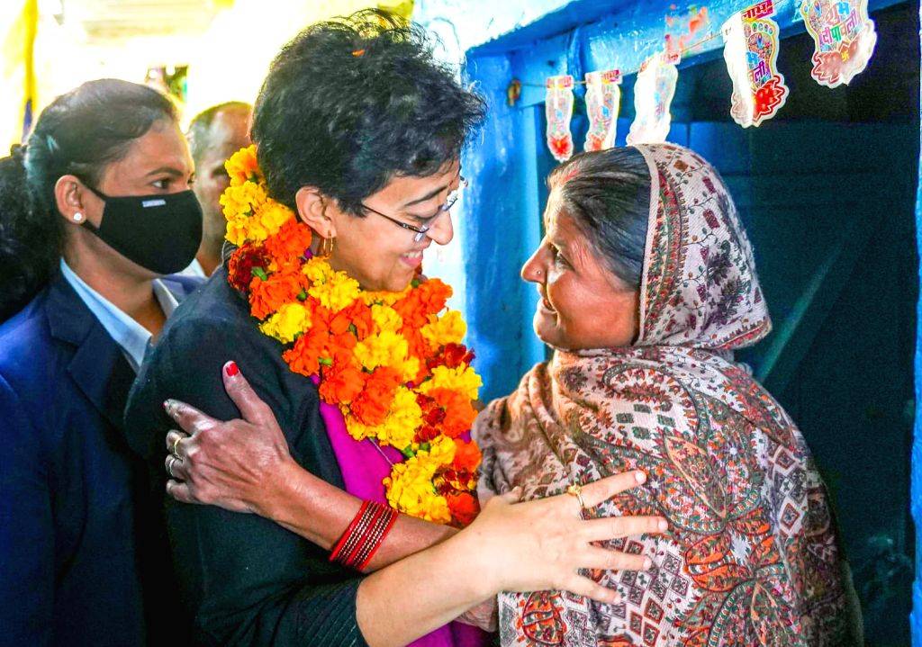 Aam Aadmi Party (AAP) leader Atishi leads a door-to-door campaign