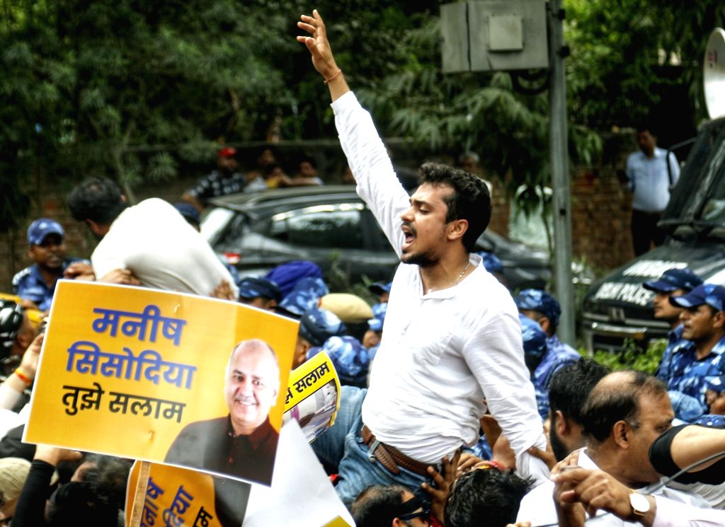 Aam Aadmi party workers stage a protest outside BJP HQ