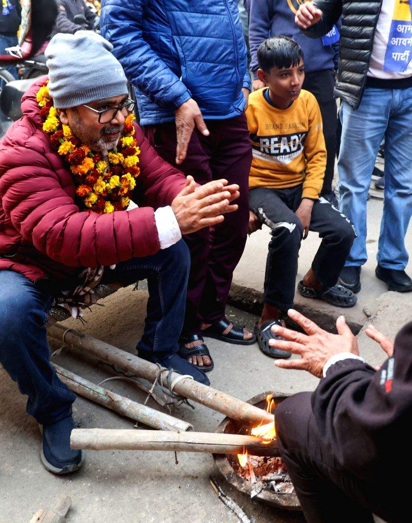 AAP candidate Awadh Ojha conducts door-to-door campaigning at Mandawali