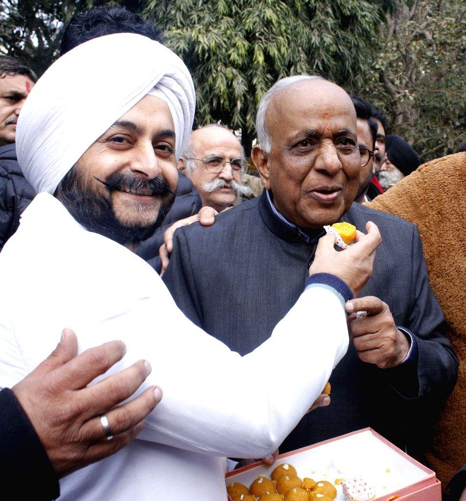 AAP candidate Narain Dass Gupta and Swati Maliwal after filing his ...