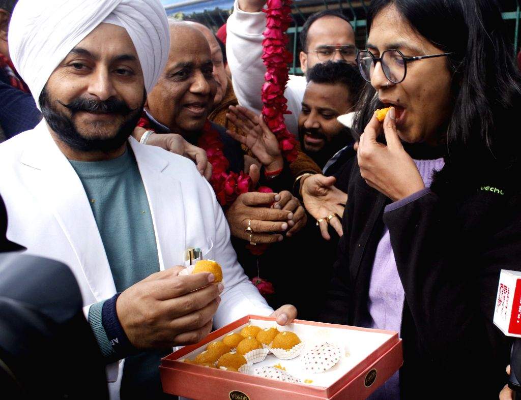 AAP candidate Narain Dass Gupta and Swati Maliwal after filing his ...