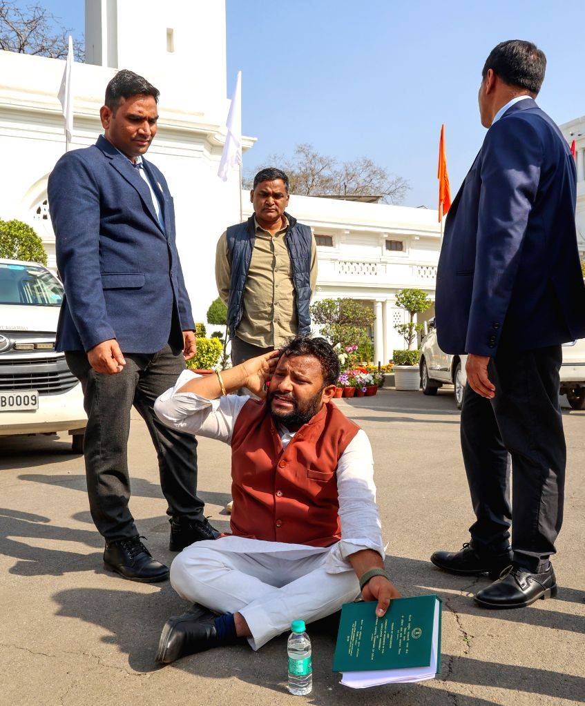 AAP MLA Kuldeep Kumar being marshalled out of Delhi Vidhan Sabha