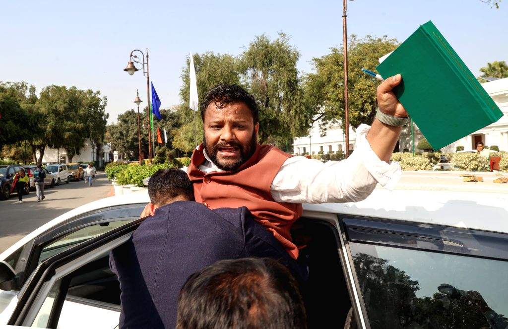 AAP MLA Kuldeep Kumar being marshalled out of Delhi Vidhan Sabha