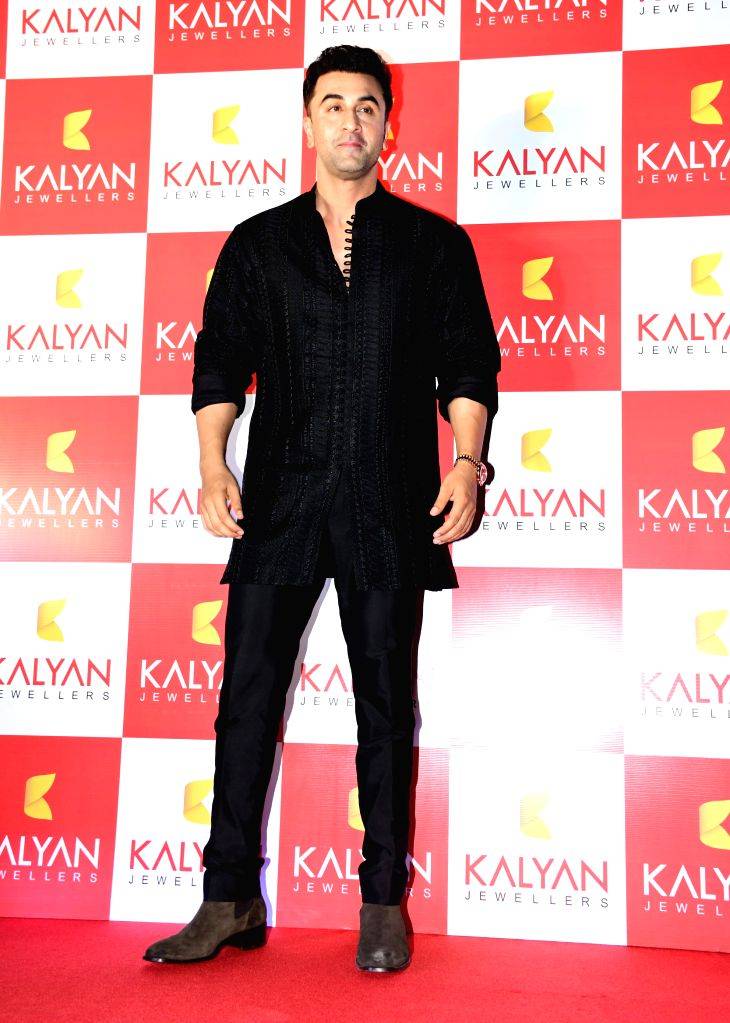 Actor Ranbir Kapoor poses for photos during an event by Kalyan Jewellers