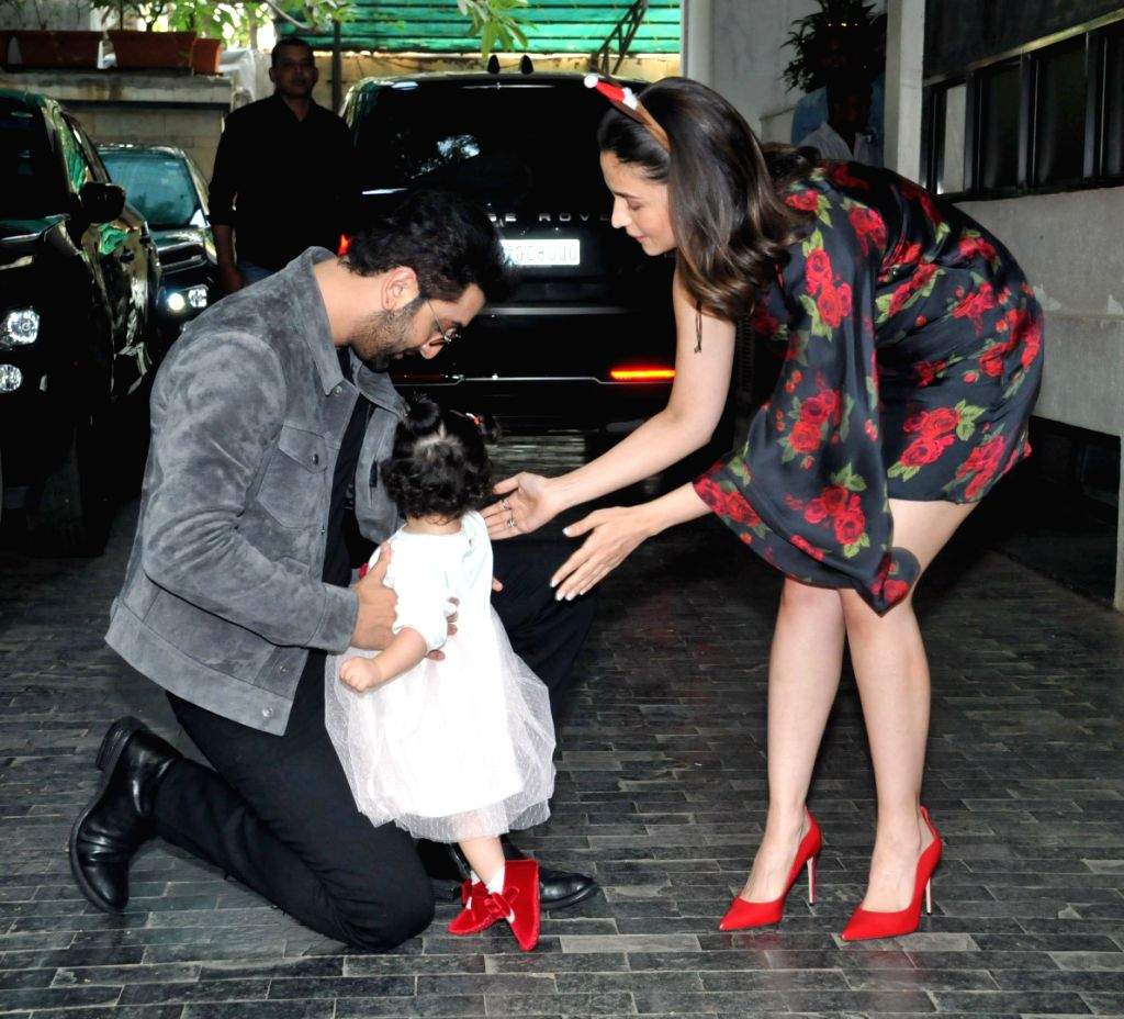Actors Ranbir Kapoor and Alia Bhatt with their daughter Raha