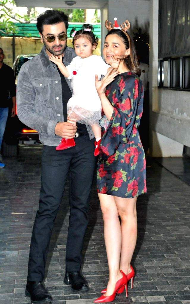 Actors Ranbir Kapoor and Alia Bhatt with their daughter Raha