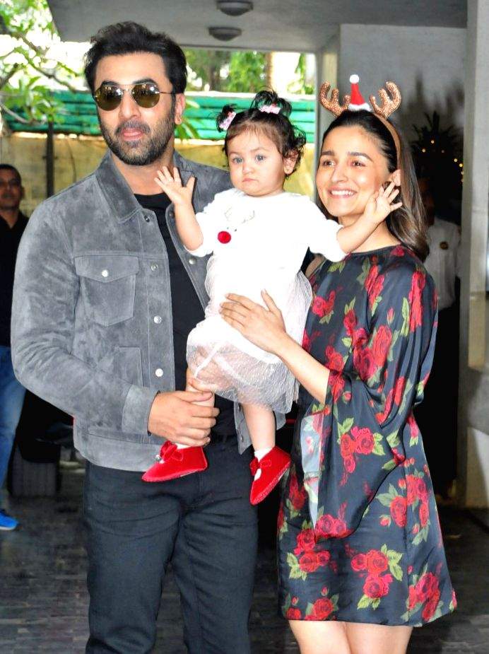 Actors Ranbir Kapoor and Alia Bhatt with their daughter Raha