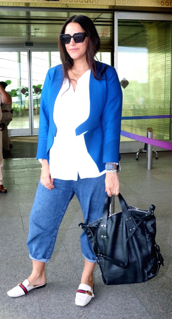 : Mumbai:Actress Neha Dhupia Spotted at Mumbai Airport
