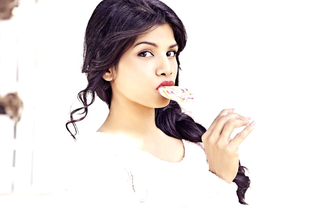 Sumann poses during a photoshoot
