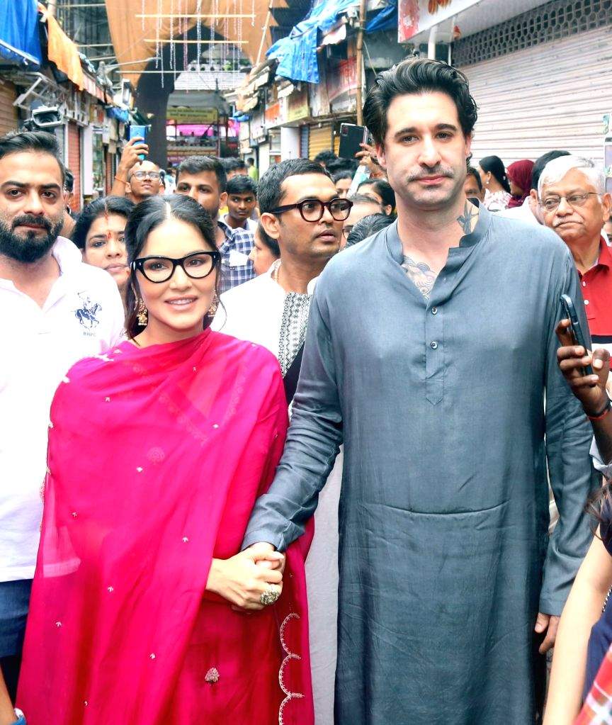 Actress Sunny Leone and her husband Daniel Weber visit Lalbaugcha Raja