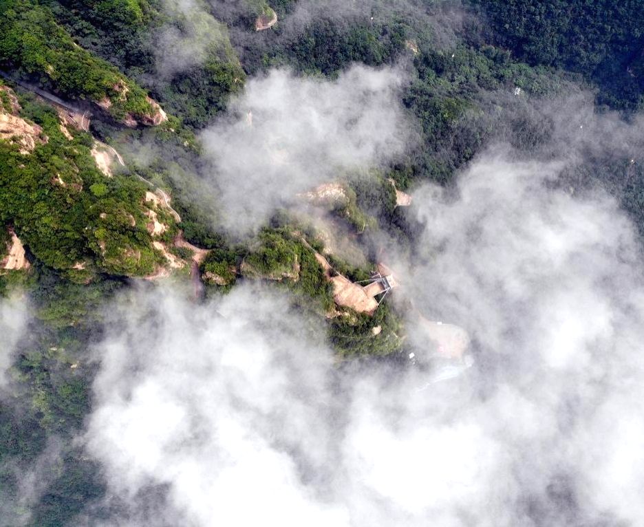 The mist-shrouded Xinglong Mountain in Chengde City