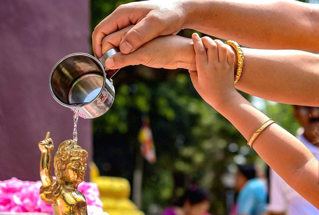 Agartala : Devotees perform rituals to Lord Buddha's idol on the ...