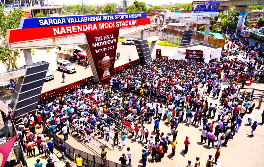 : Ahmedabad : Cricket fans standing in queue to collect their online ...