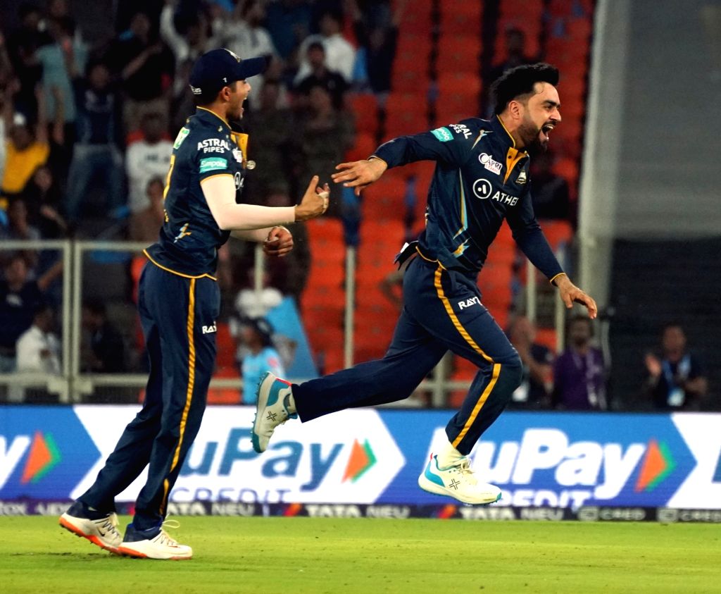 Ahmedabad : GT captain Rashid Khan celebrates the wicket of GT's ...