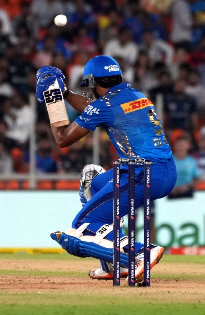 Ahmedabad : MI's batsman Tilak Varma avoids a bouncer